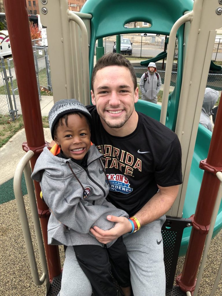 Florida State football’s Logan Tyler gives winter clothes to children ...
